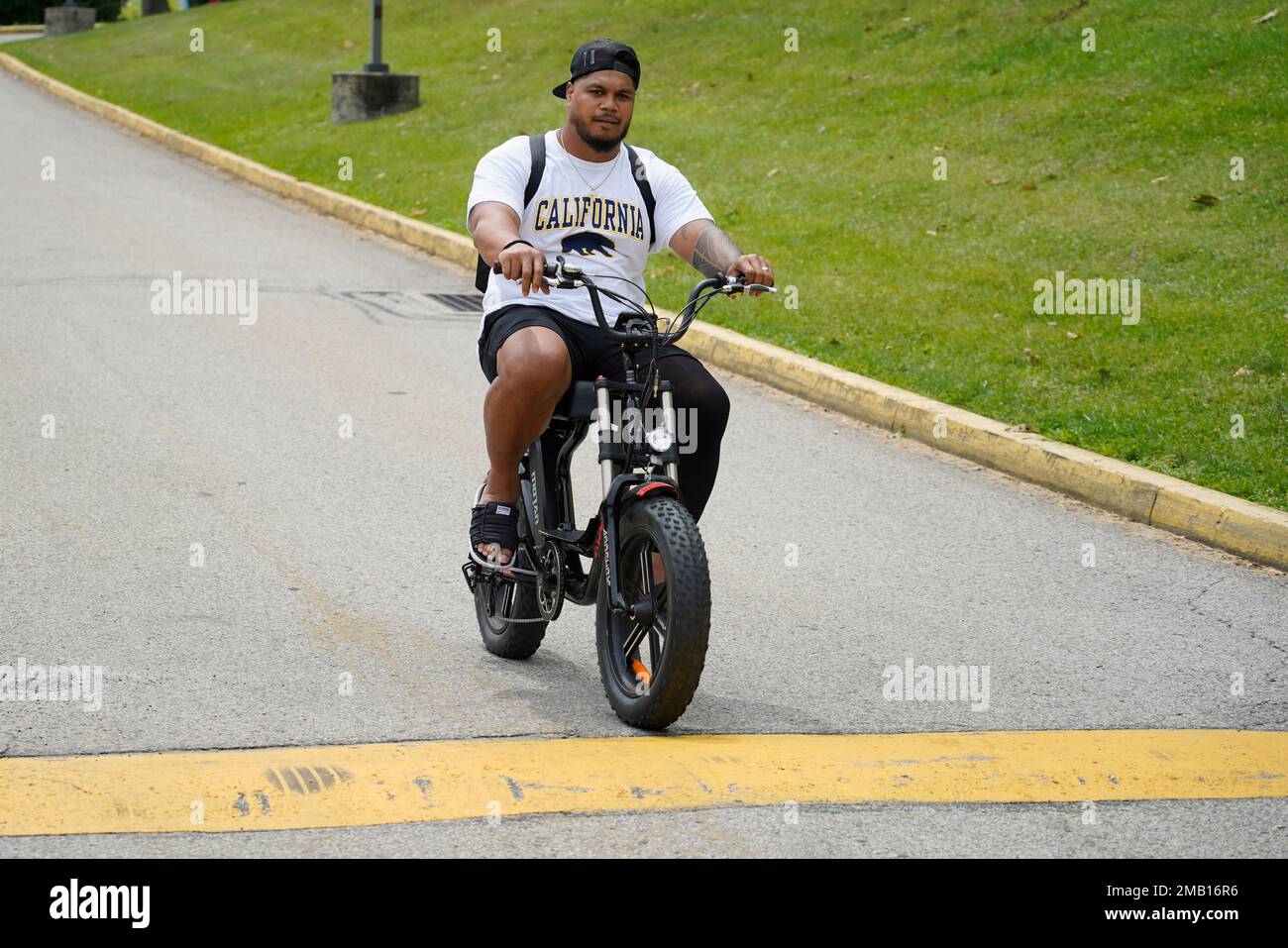 Pittsburgh Steelers defensive lineman Tyson Alualu rides an electric ...