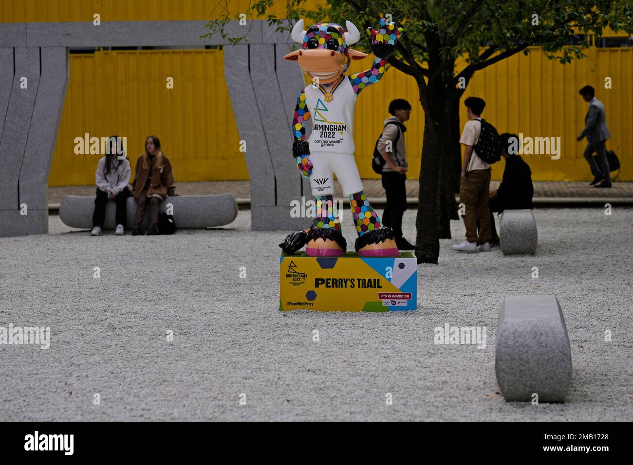 People spend time next to the Commonwealth Games mascot, Perry the Bull ...