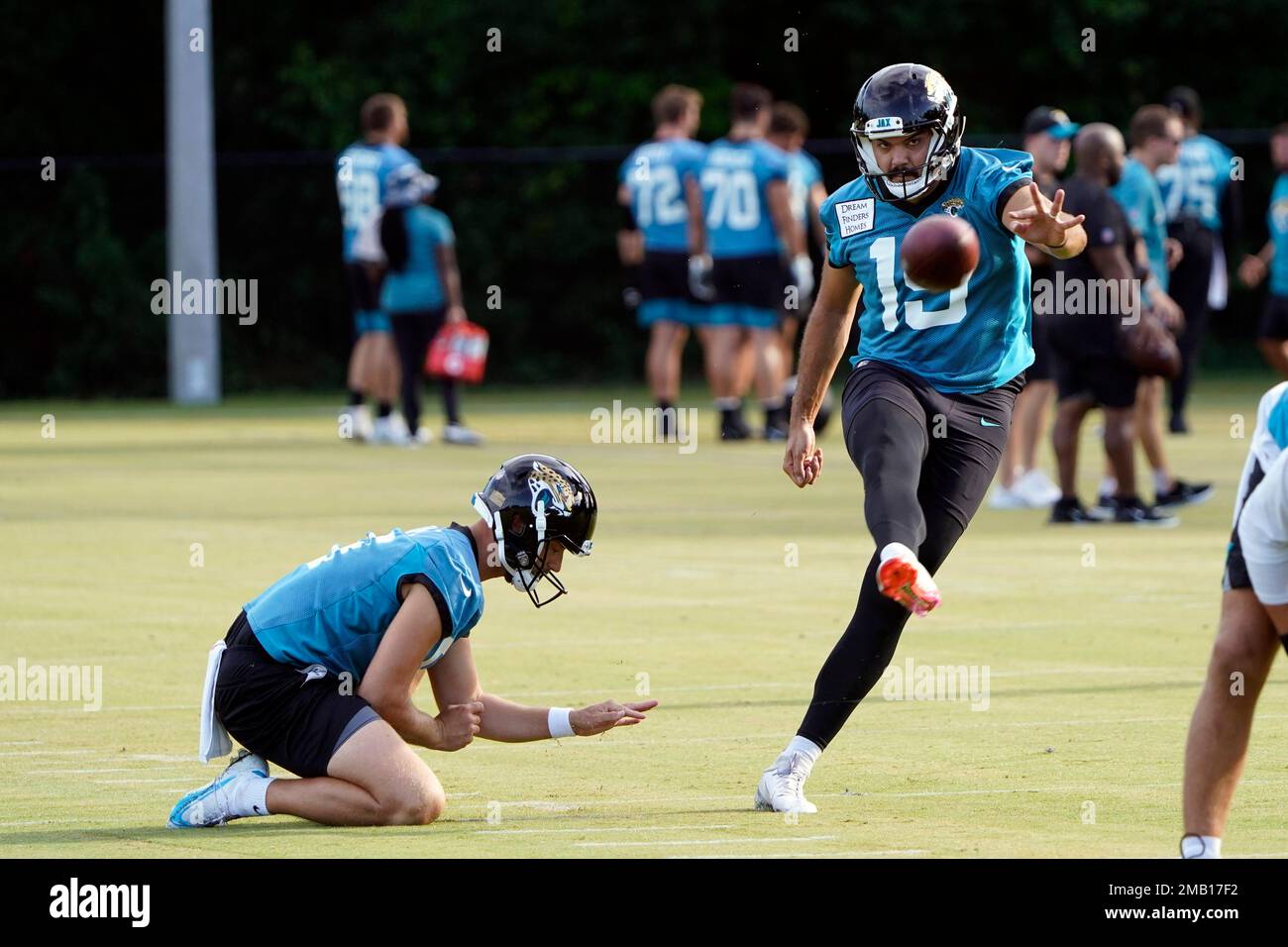 Jacksonville Jaguars kicker Ryan Santoso works on field goals during an ...