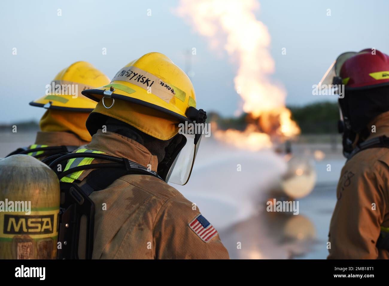 Students assigned to the 312th Training Squadron control a gas cylinder ...