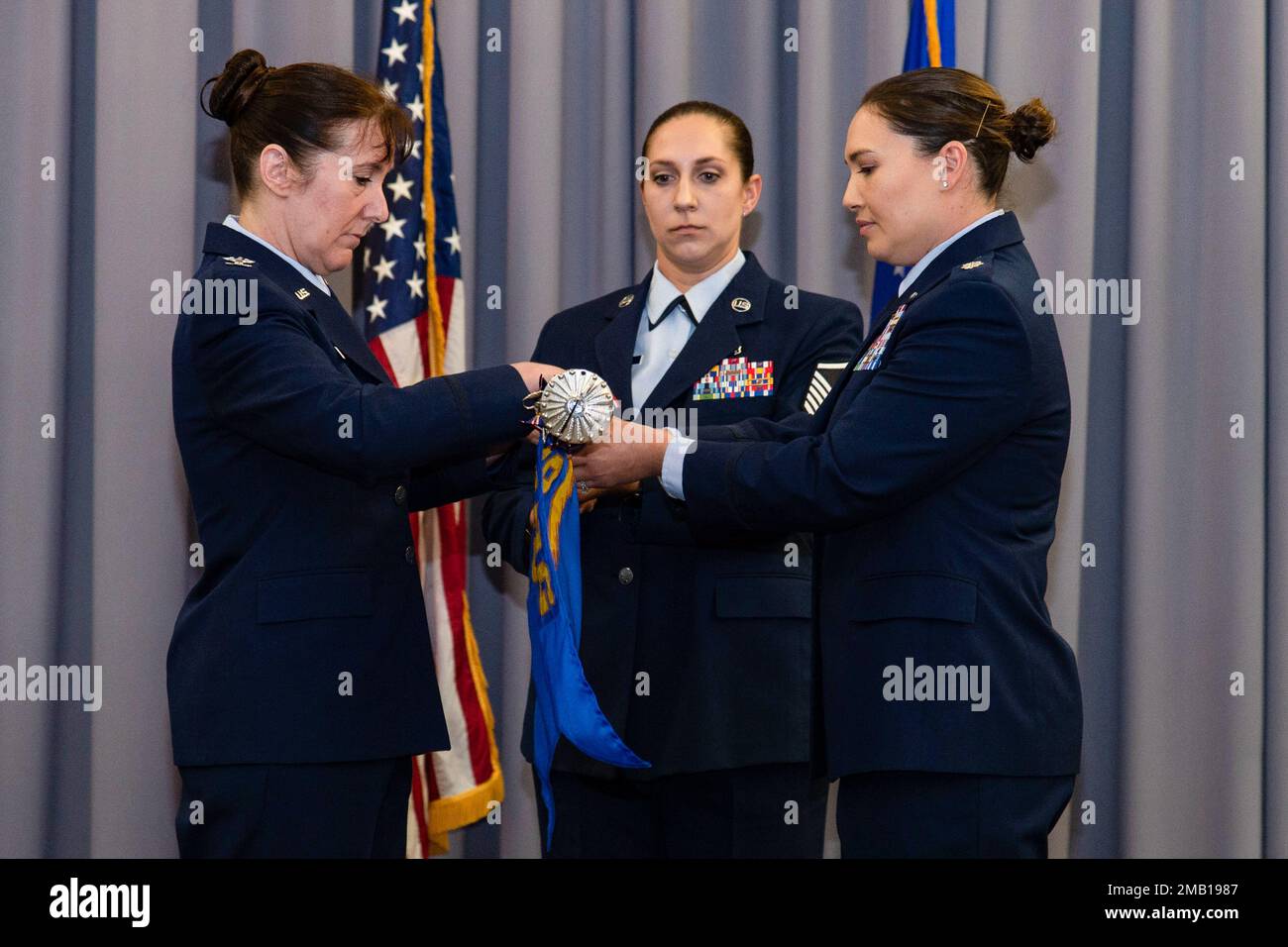 Lt. Col. Kristen Carter, right, outgoing 436th Medical Support Squadron ...