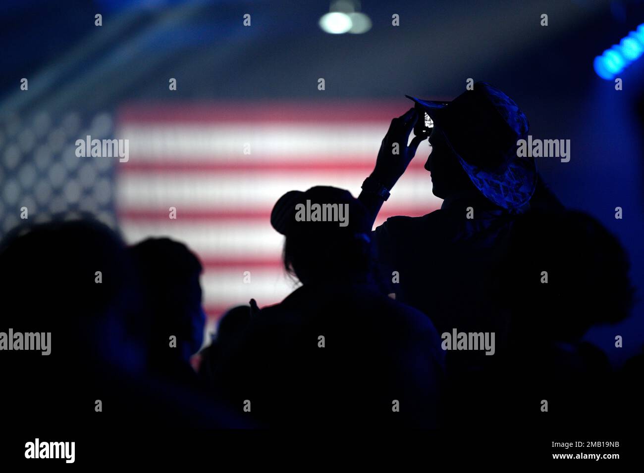 Attendees watch as former President Donald Trump speaks during the ...