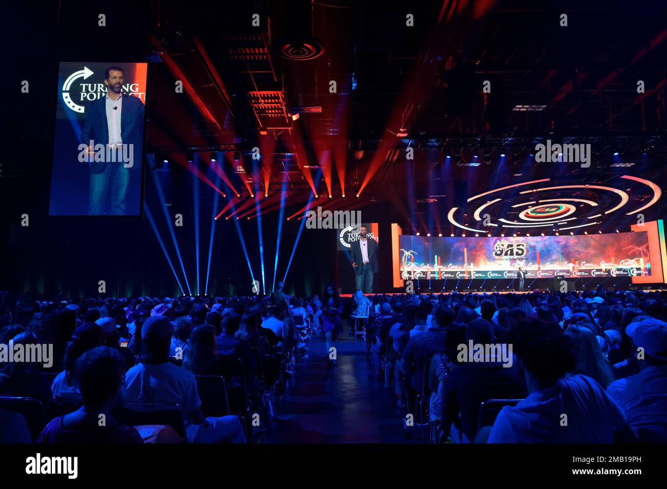 Attendees watch as Donald Trump Jr. speaks during the Turning Point USA ...