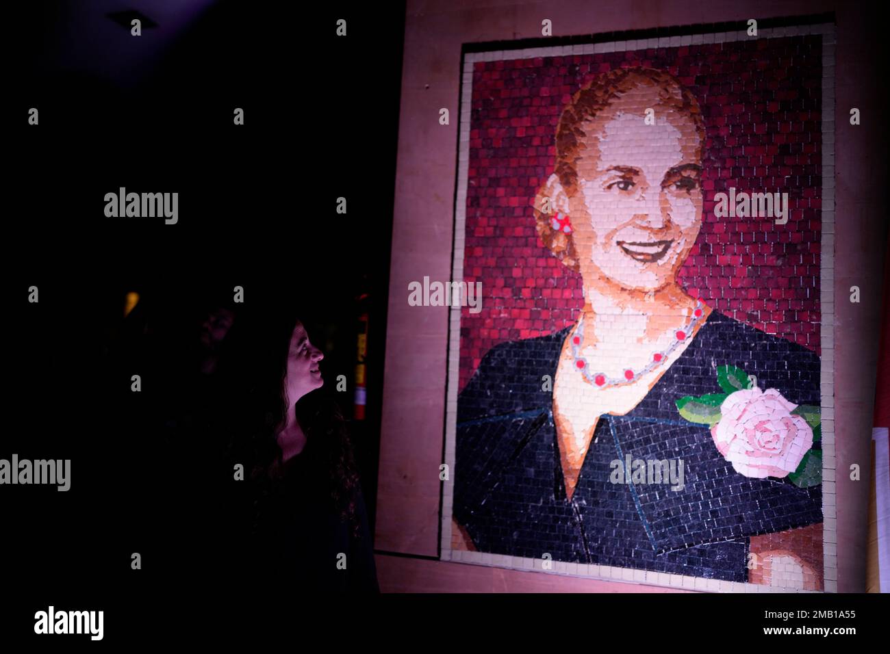 A woman looks at a portrait of Argentina's late former first lady Maria ...