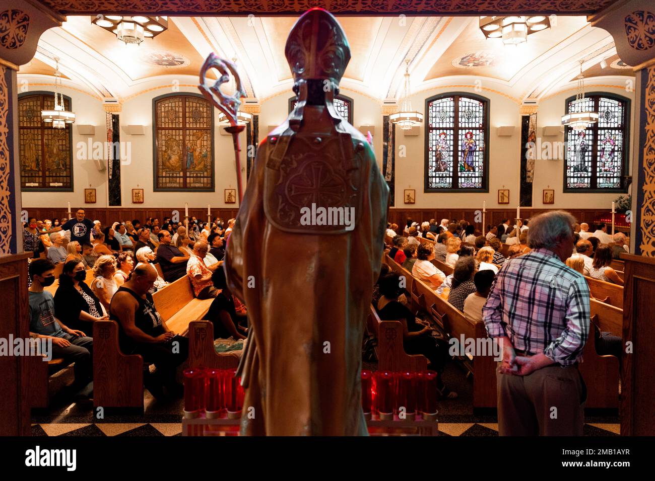 Parishioners attend the coronation mass of the Giglio feast at the Shrine Church of Our Lady of ...