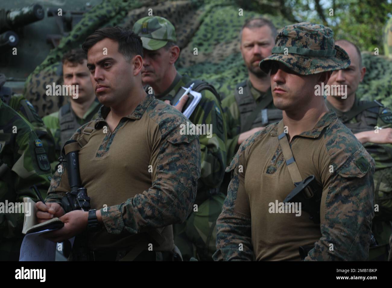 U.S. Marine Corps Capt. Moises Navas, company commander, left, 1st Lt ...