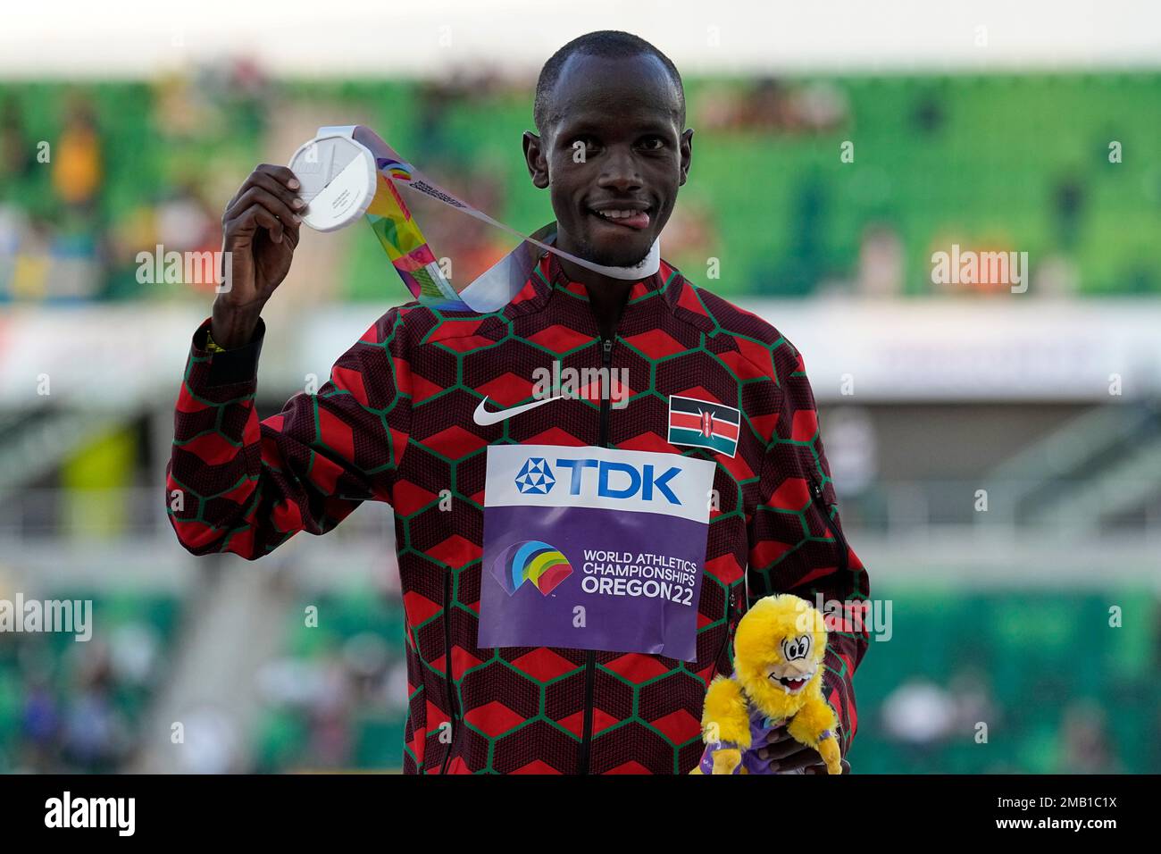 Silver medalist Jacob Krop, of Kenya, poses during a medal ceremony for ...