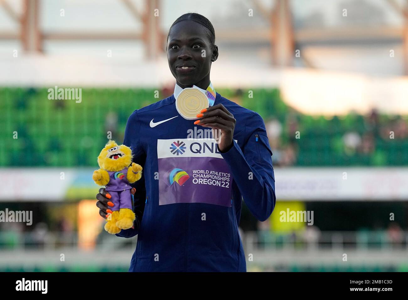 Gold medalist Athing Mu, of the United States, poses during a metal ...