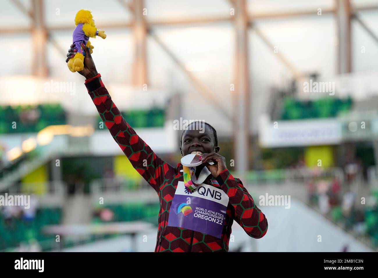 Bronze medalist Mary Moraa, of Kenya, poses during a metal ceremony for ...