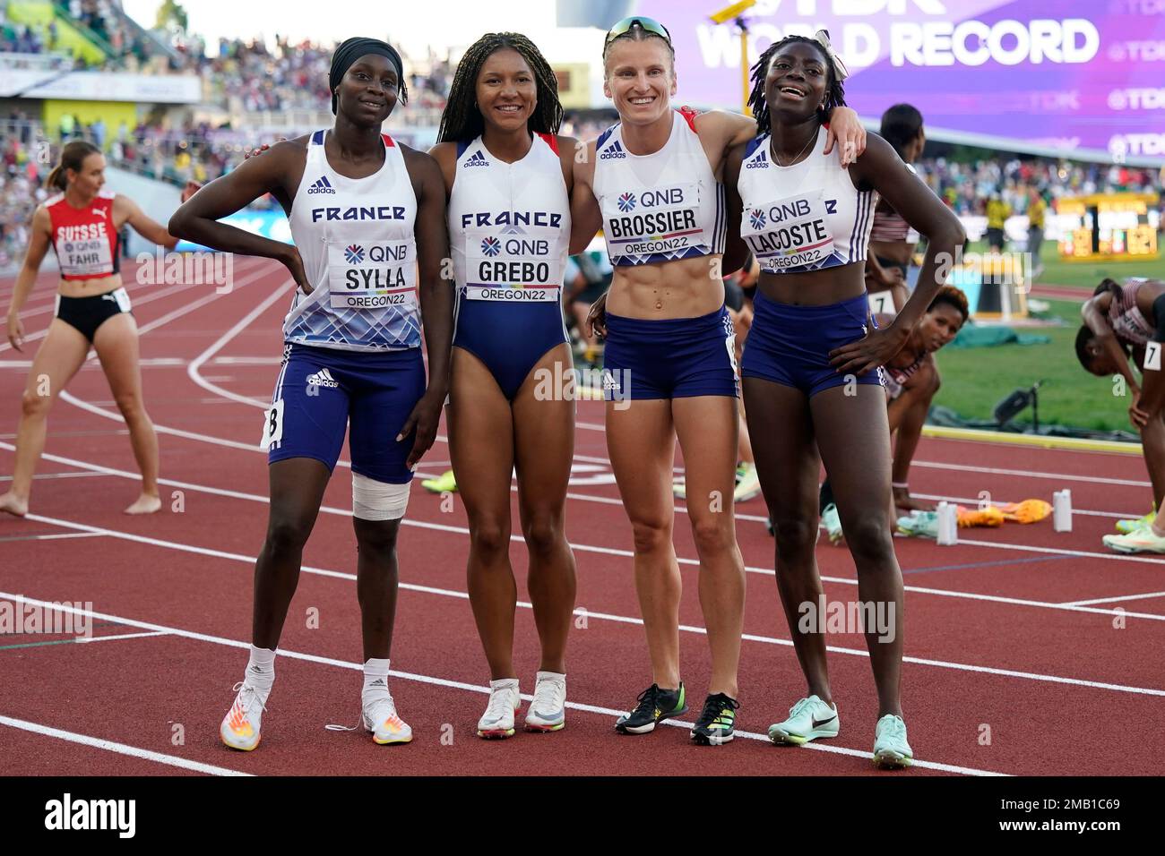 Team France celebrate after the women's 4x400-meter relay final at the ...