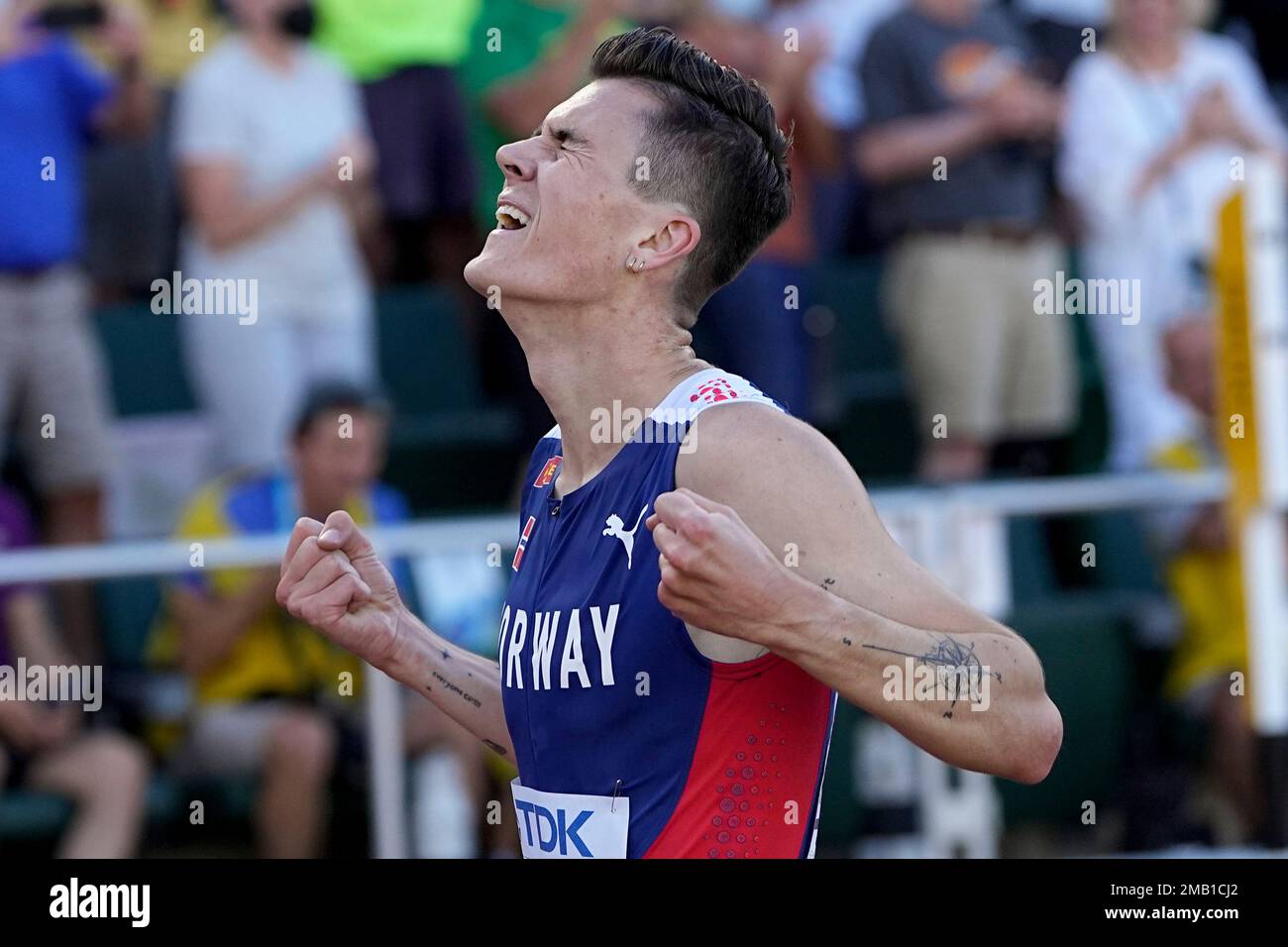 Gold medalist Jakob Ingebrigtsen, of Norway, celebrates after the men's ...