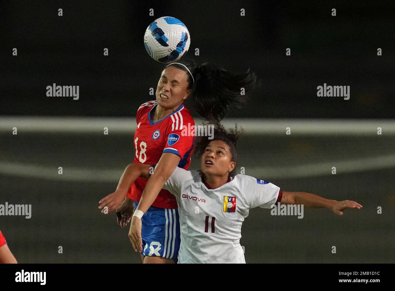 Chile's Camila Saenz and Venezuela's Oriana Altuve go for a header ...