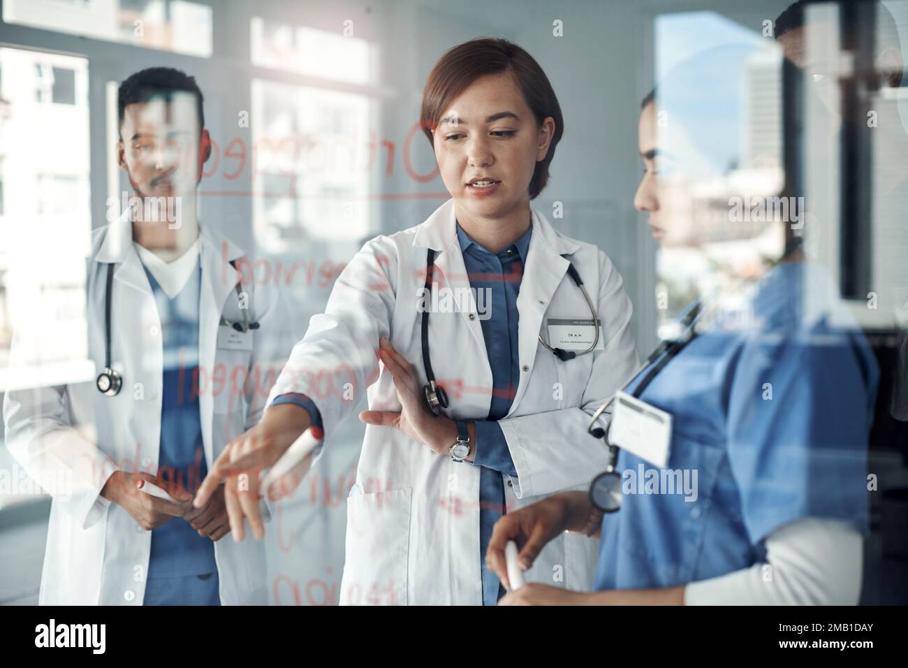 Behind every fine doctor, there is always a nurse. Shot a group of ...