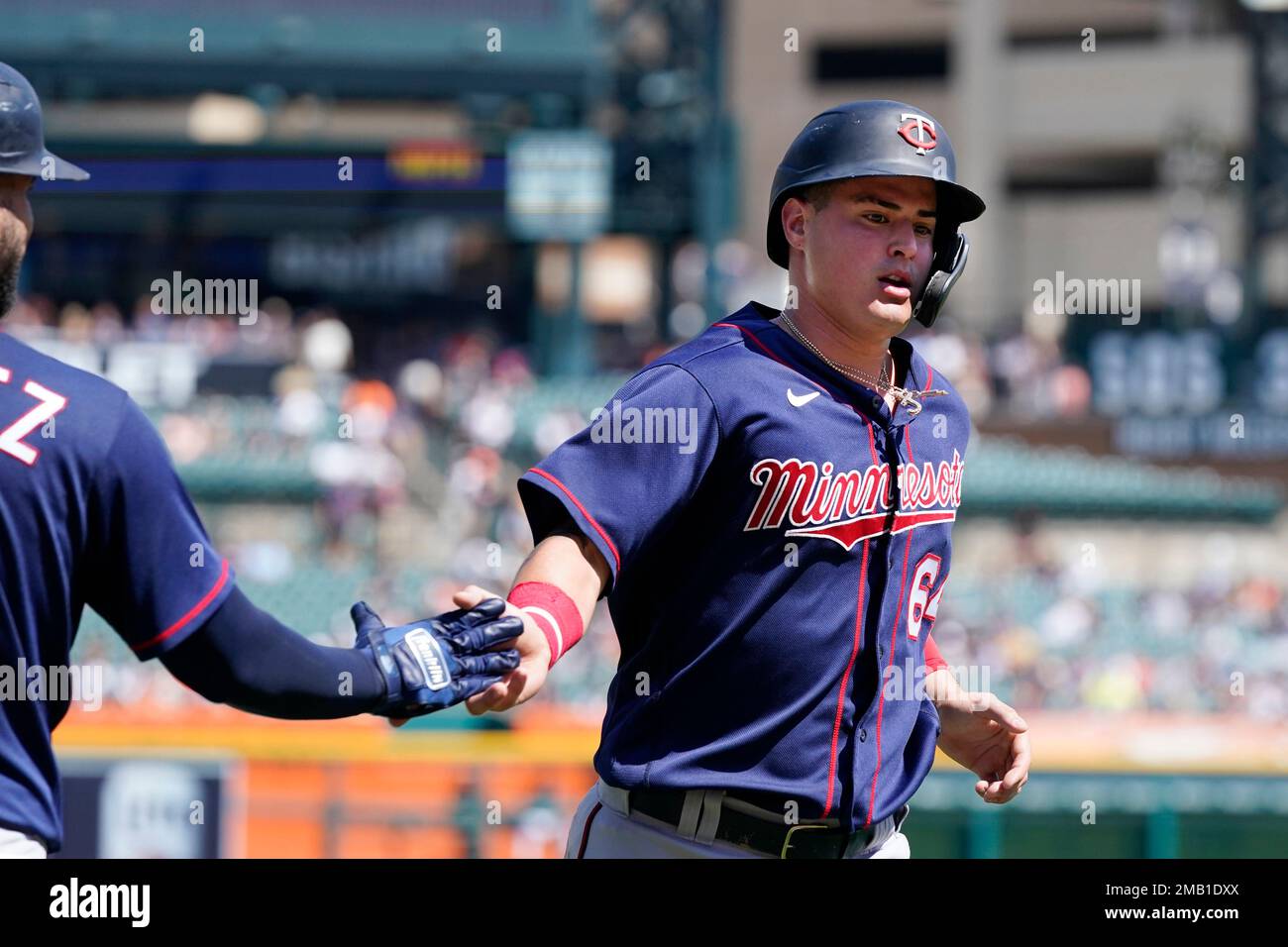Minnesota Twins first baseman Jose Miranda is greeted by teammate Gary ...