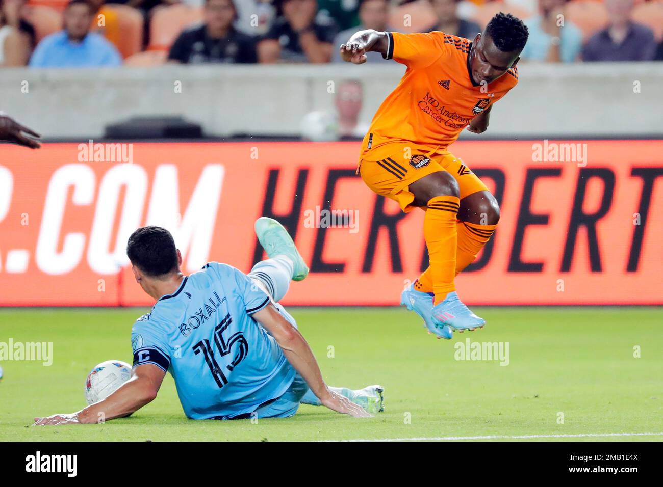 Minnesota United defender Michael Boxall (15) slide tackles as Houston ...