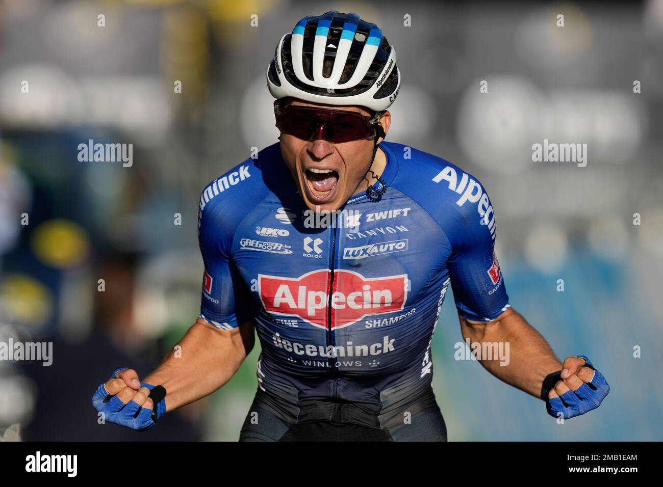 Stage winner Belgium's Jasper Philipsen celebrates a he crosses the ...
