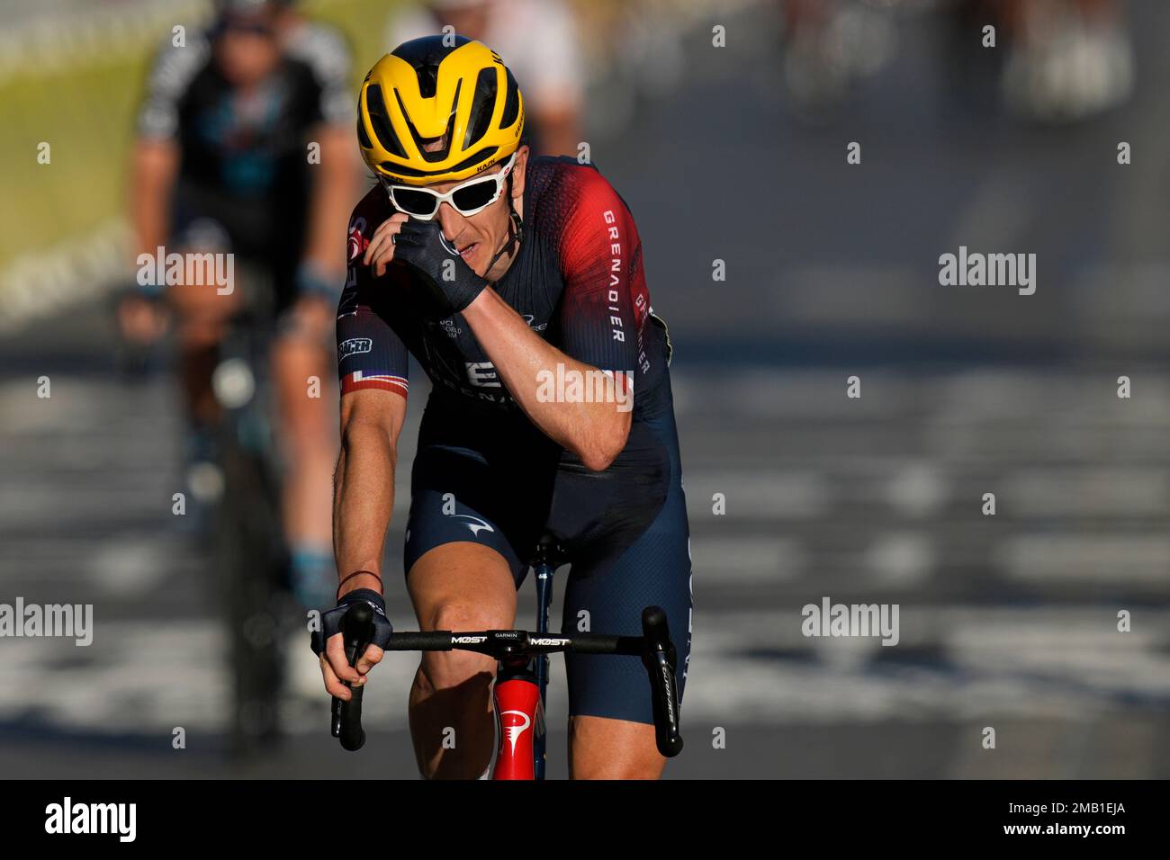 Britain's Geraint Thomas crosses the finish line of the twenty-first ...