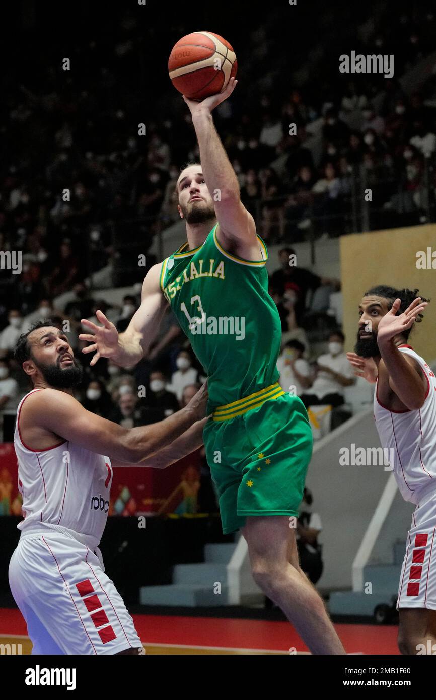Australia's Samson James Froling, center, shoots against Lebanon's ...