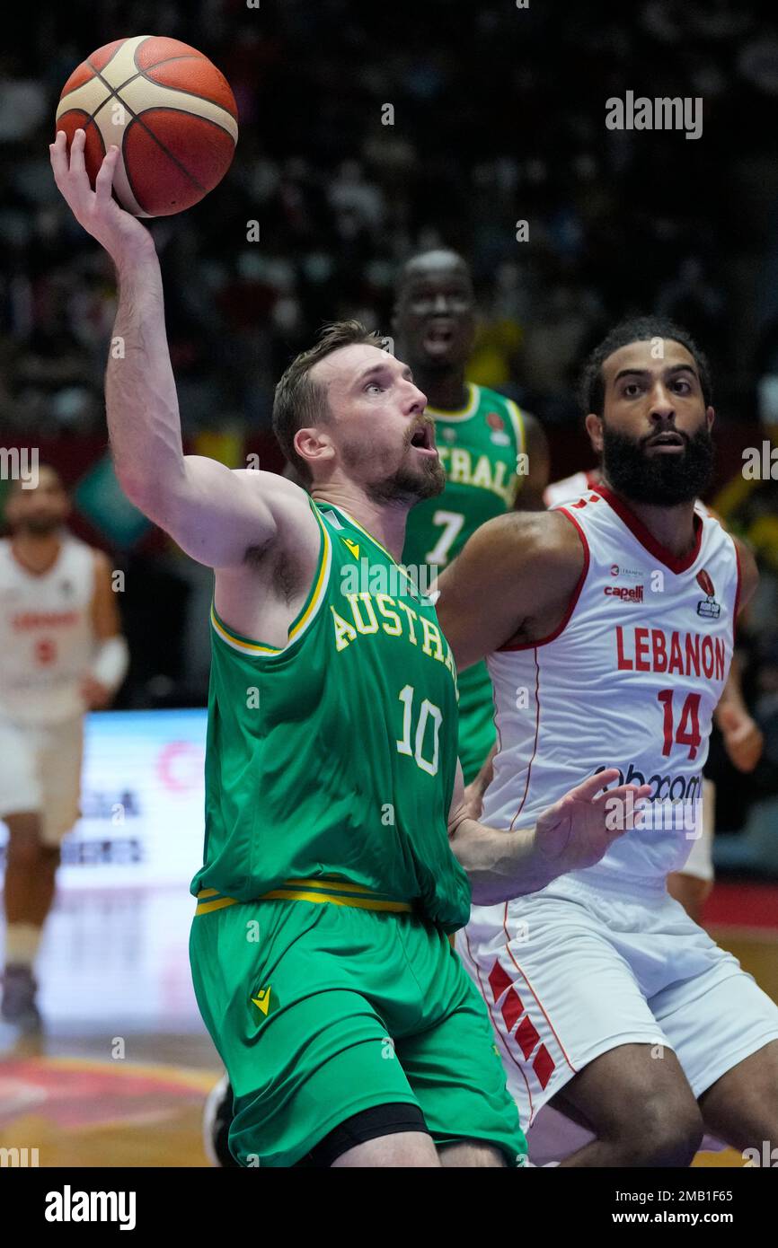 Australia's Mitchell McCarron,left, makes a ay up against Lebanon's ...
