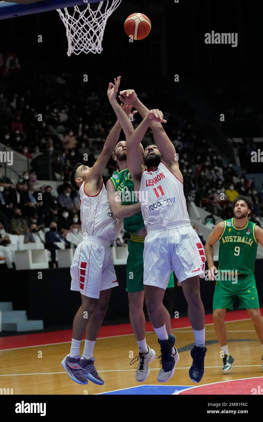 Australia's Samson James Froling, center, battles for a rebound against ...