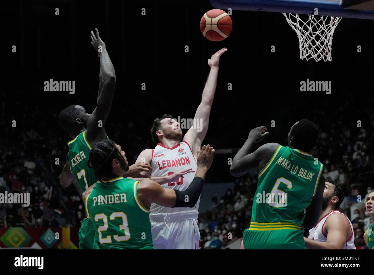 Lebanon's Wael Arakji, center, shoots against Australia's Thon Maker ...