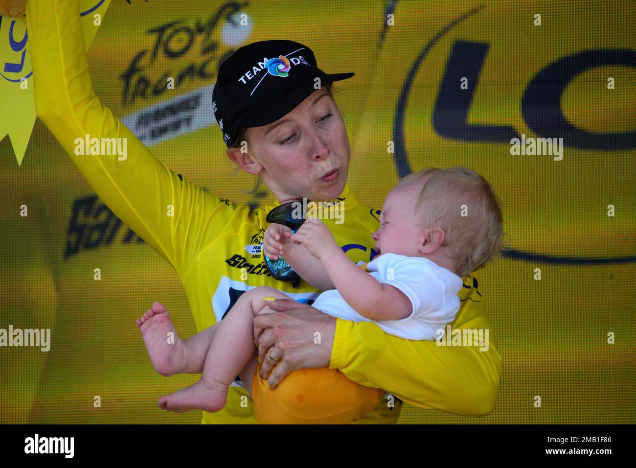 Netherland's Lorena Wiebes, wearing the overall leader's yellow jersey ...