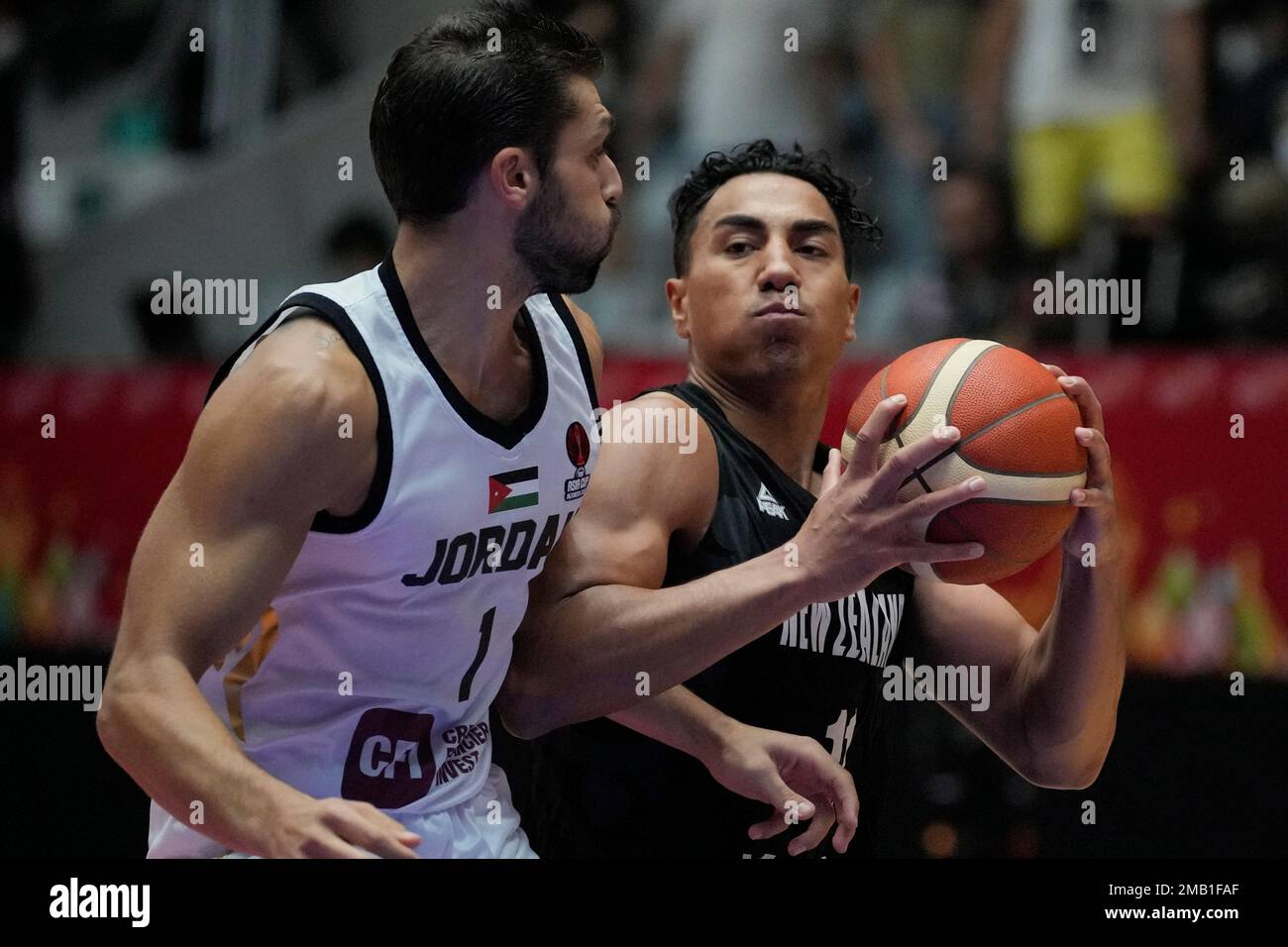New Zealand's Flynn Cameron, right, plays against Jordan's Amin Abu ...