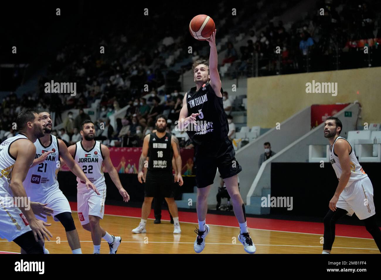 New Zealand's Taylor Britt, center, shoots against Jordan's Hashem ...