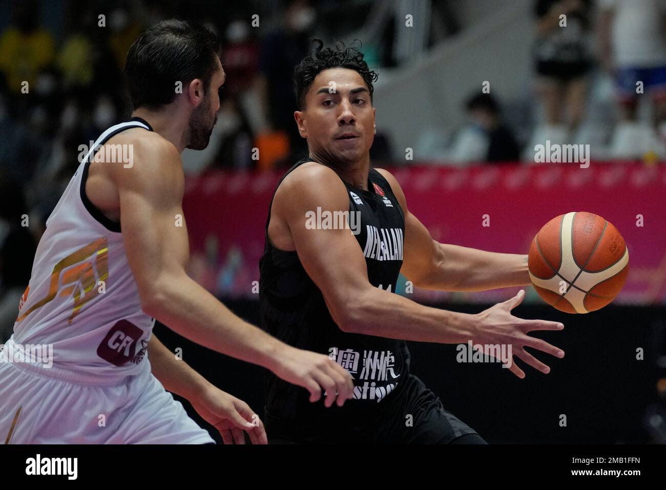 New Zealand's Flynn Cameron, right plays against Jordan's Amin Abu ...