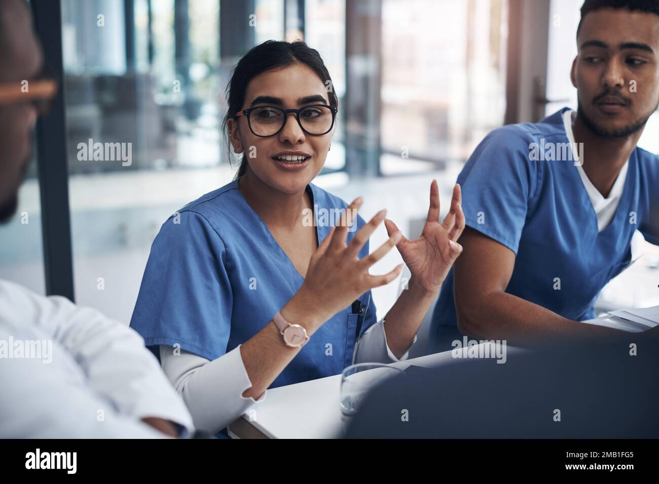 Time to make a change. medical nurses having a meeting with their ...