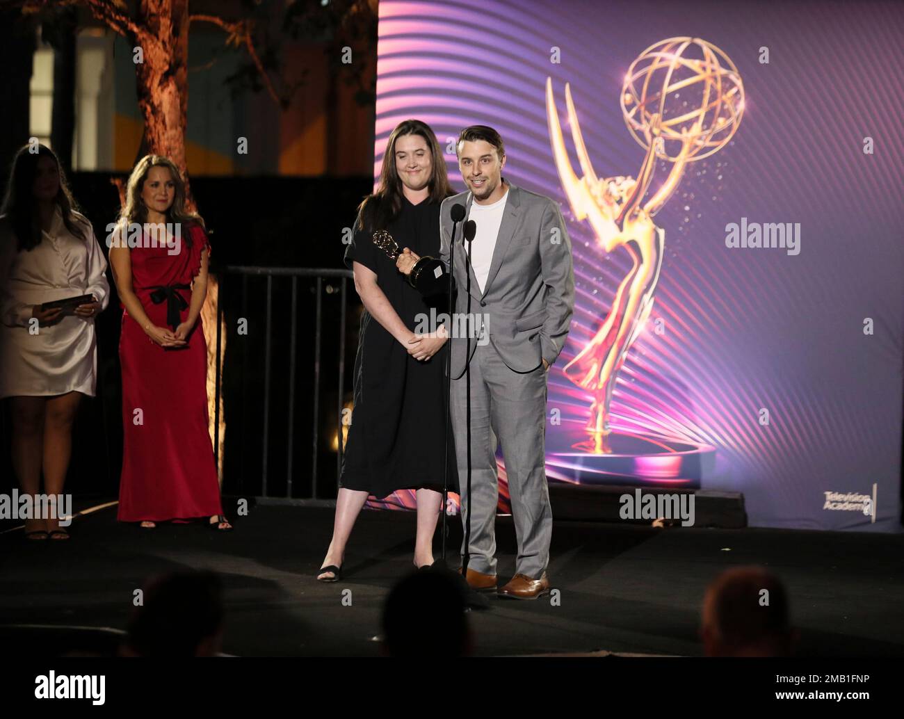 Anna Rau, left, and Corbett Jones accept the Culture/History Emmy for ...