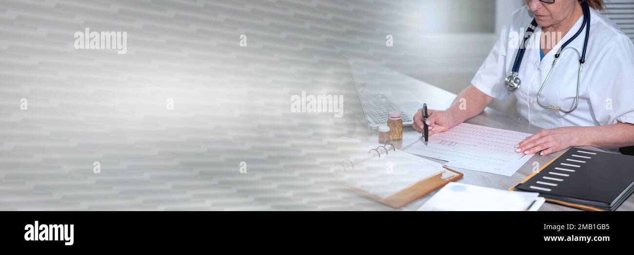 Female cardiologist examining an ecg graph in medical office; panoramic ...