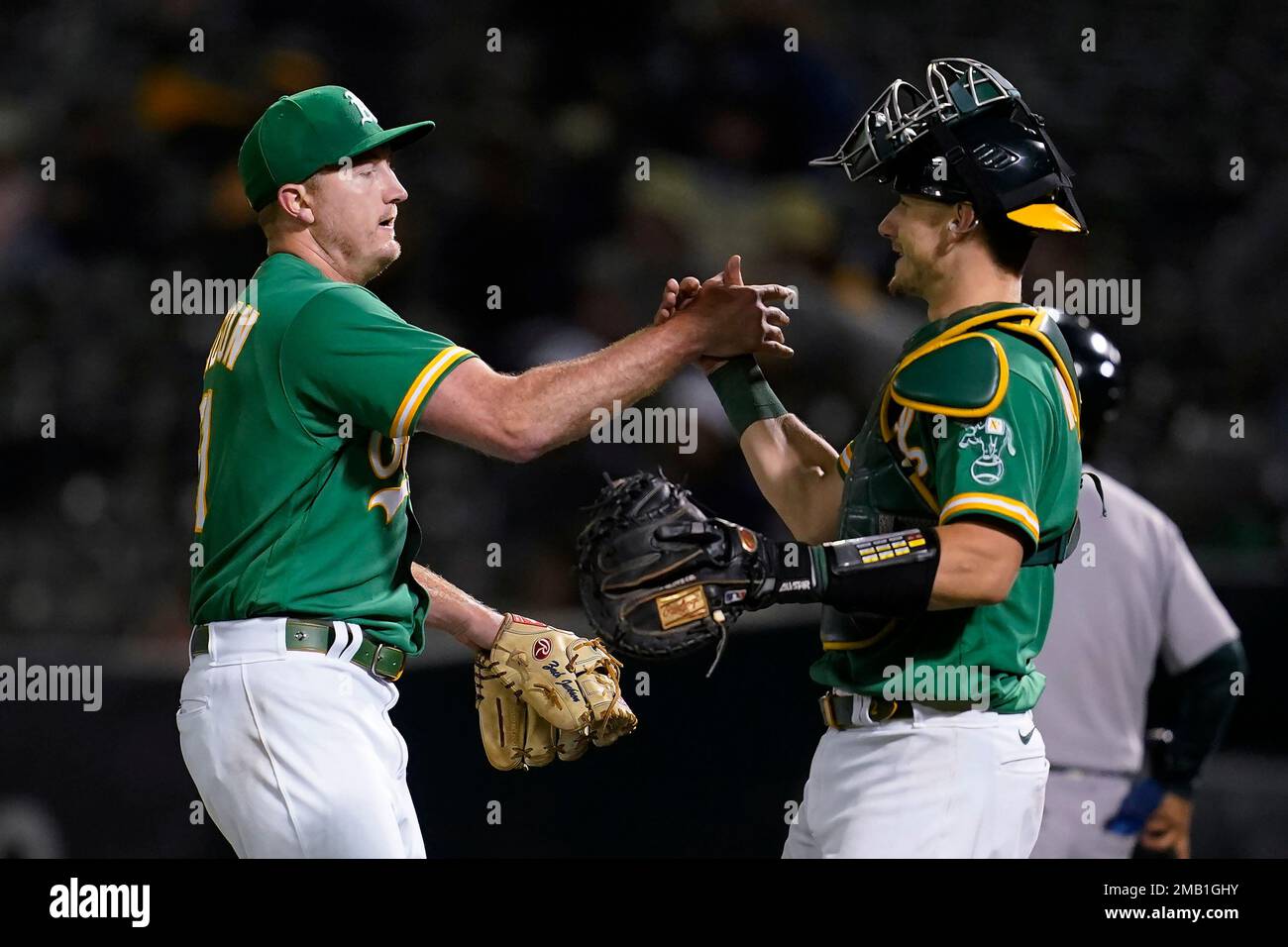 Oakland Athletics pitcher Zach Jackson, left, celebrates with catcher ...