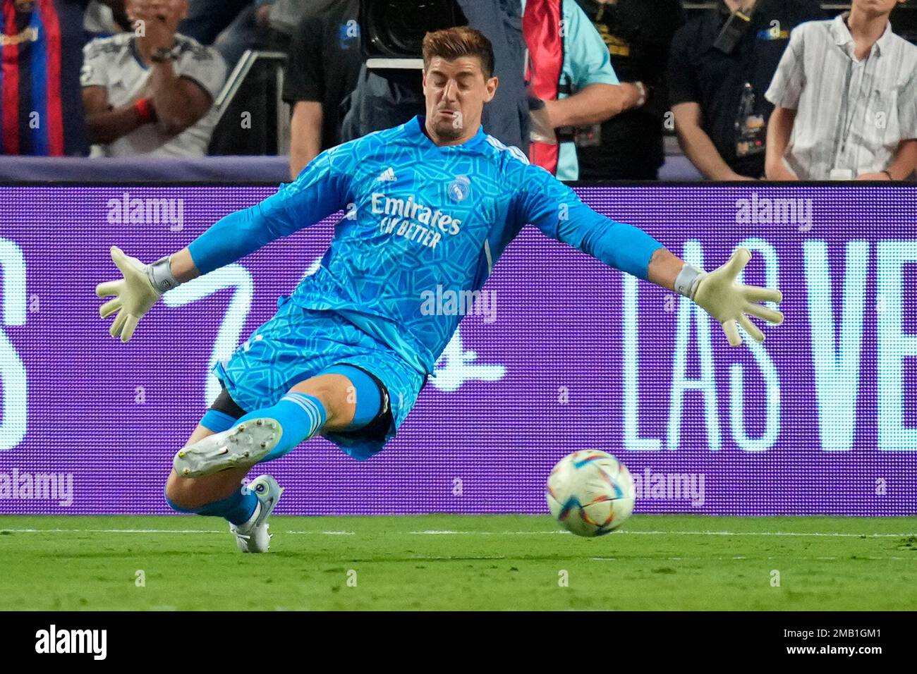 Real Madrid goalkeeper Thibaut Courtois attempts to stop a shot by ...