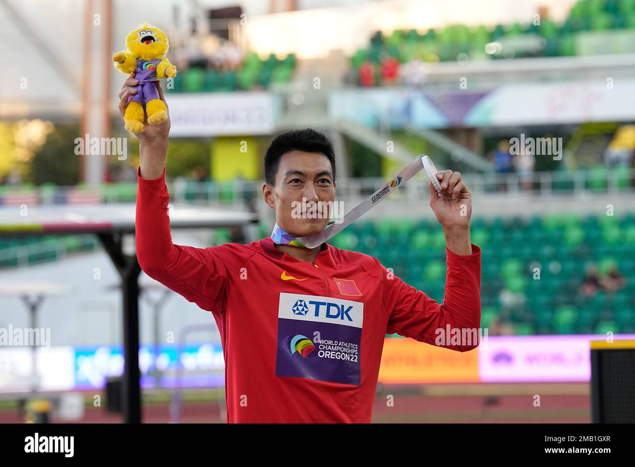 Bronze medalist Zhu Yaming, of China, poses during a medal ceremony for ...
