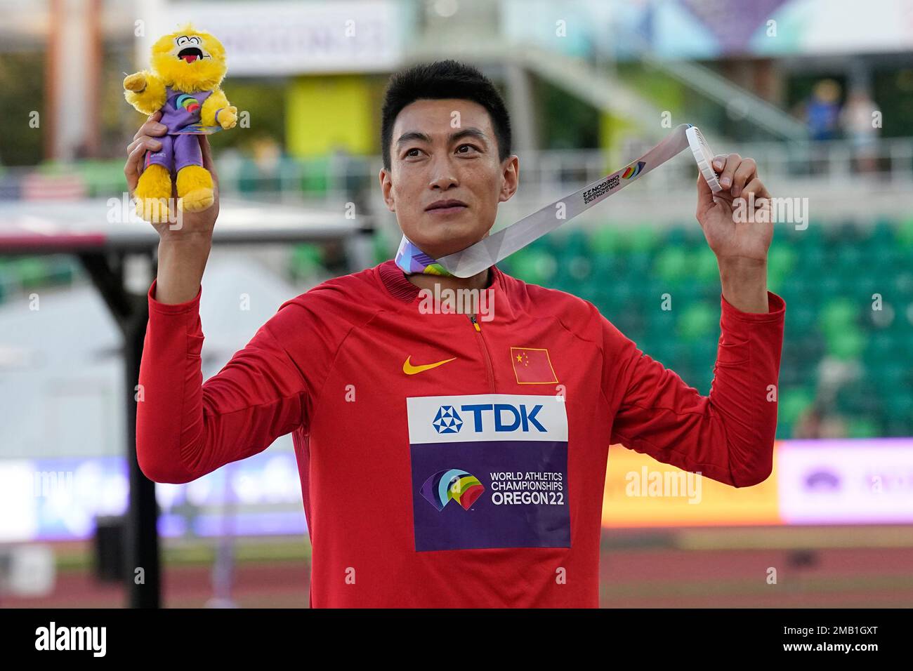 Bronze medalist Zhu Yaming, of China, poses during a medal ceremony for the men's triple jump at ...