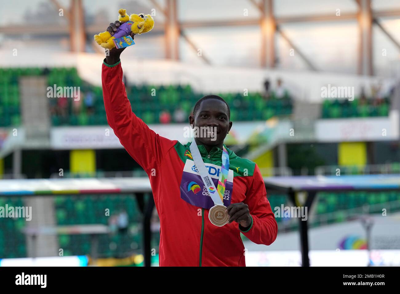 Gold medalist Anderson Peters, of Grenada, poses during a medal ...