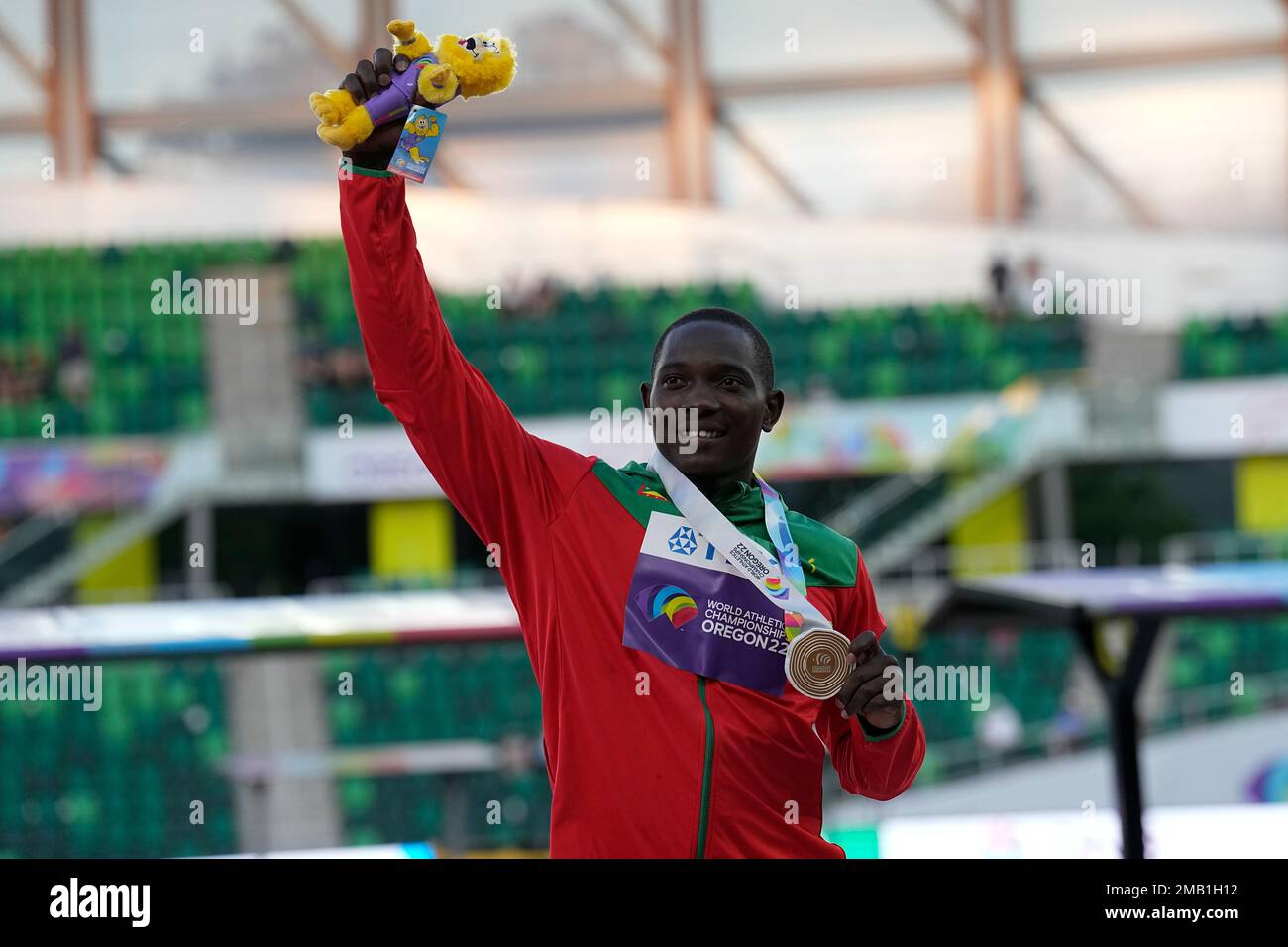 Gold medalist Anderson Peters, of Grenada, poses during a medal ...