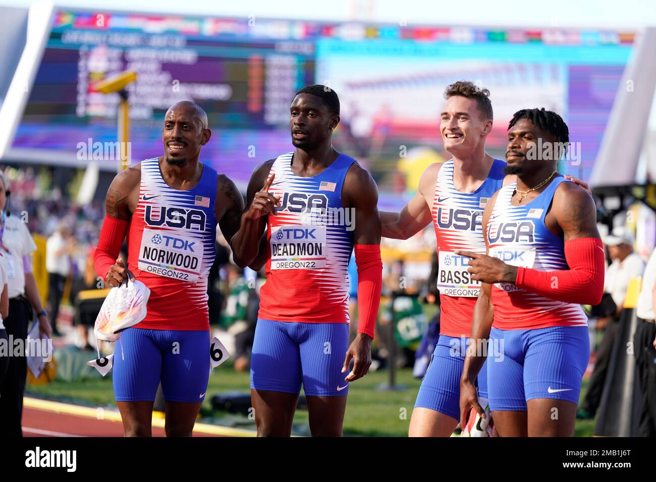 Team USA poses on the track after a heat during the men's 4x400-meter ...