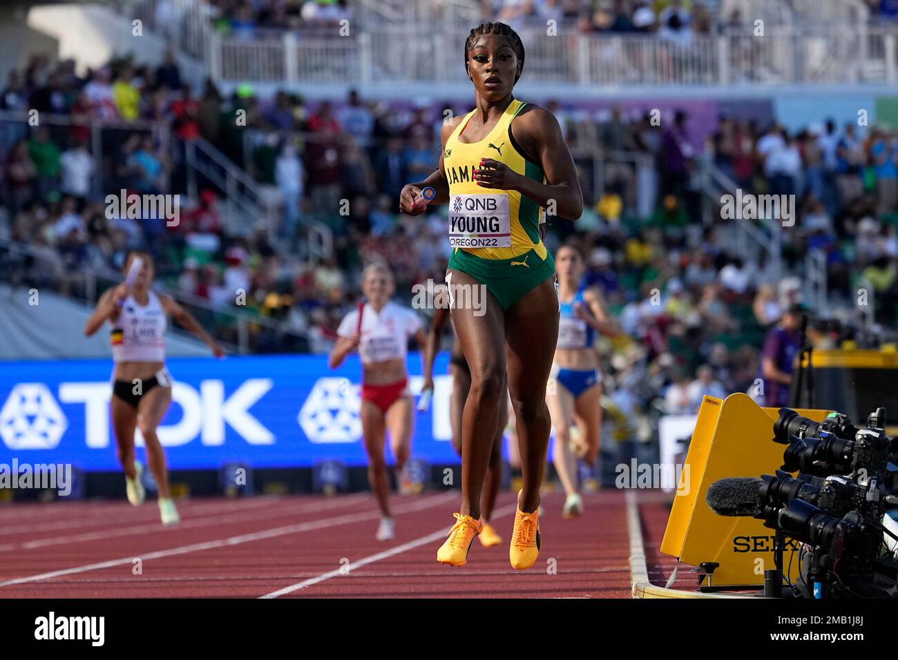 Charokee Young, of Jamaica, wins a heat during the women's 4x400-meter ...