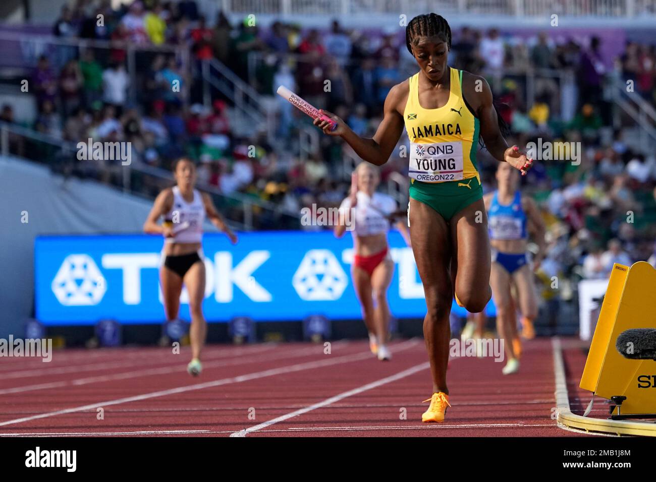 Charokee Young, of Jamaica, wins a heat during the women's 4x400-meter ...
