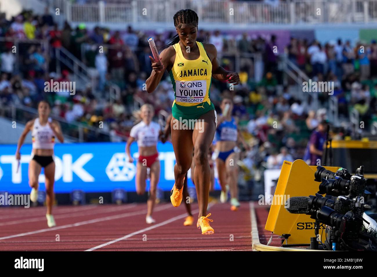 Charokee Young, of Jamaica, wins a heat during the women's 4x400-meter ...