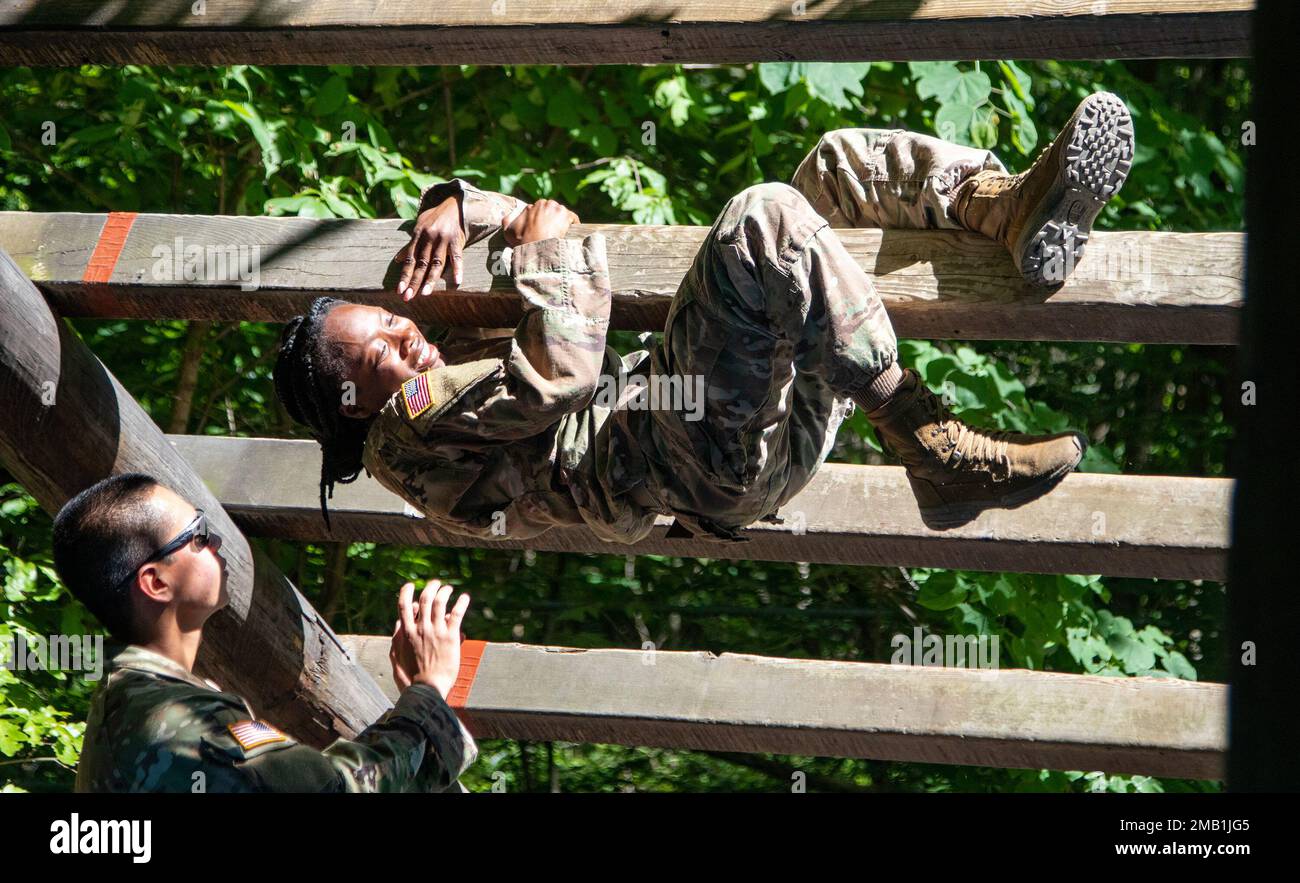Cadets climb up the weaver obstacle on the obstacle course on Fort Knox ...