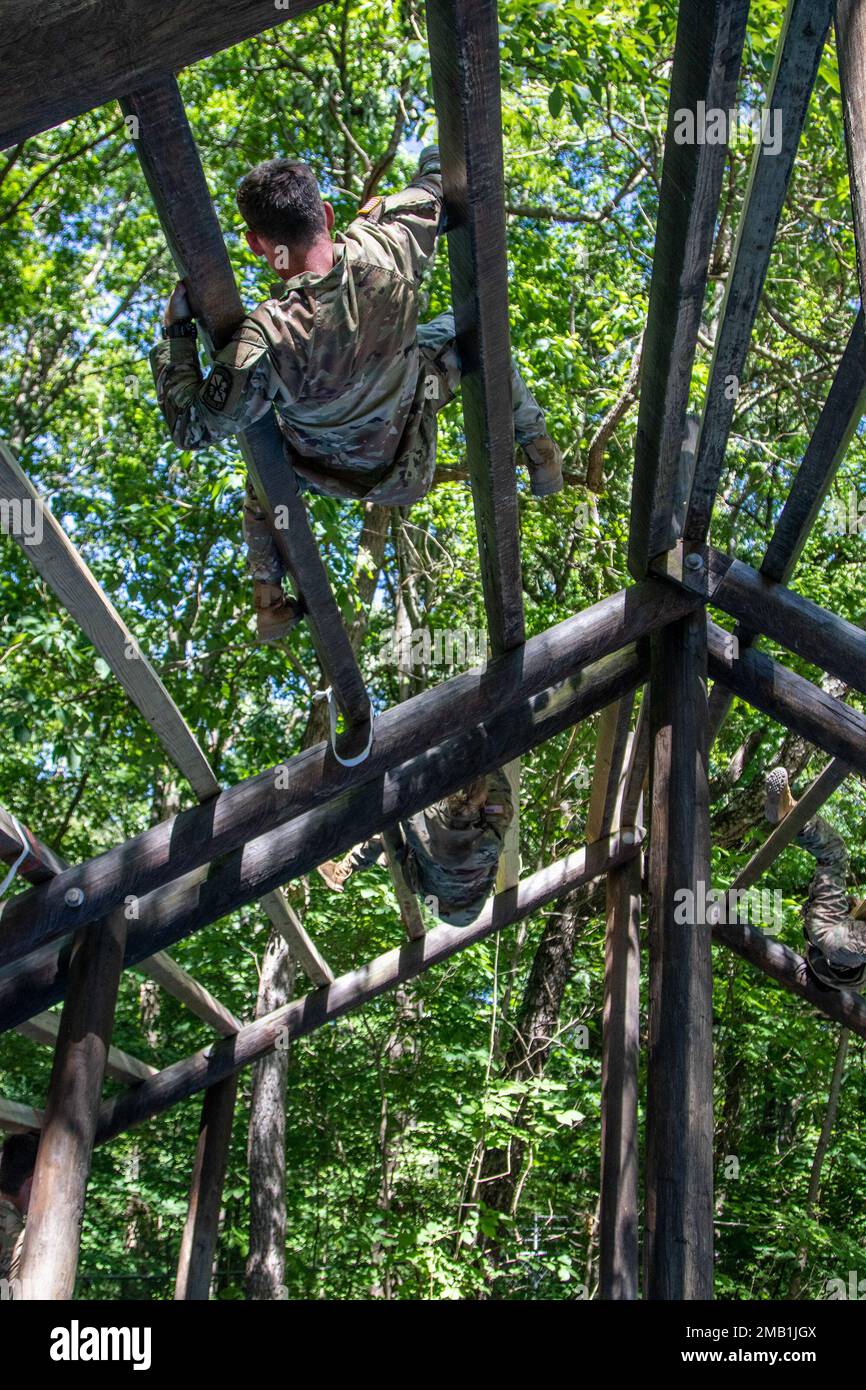 Cadets climb up the weaver obstacle on the obstacle course on Fort Knox ...