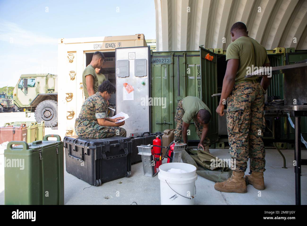 U.S. Marines with Marine Wing Support Squadron (MWSS) 273 inspect gear ...
