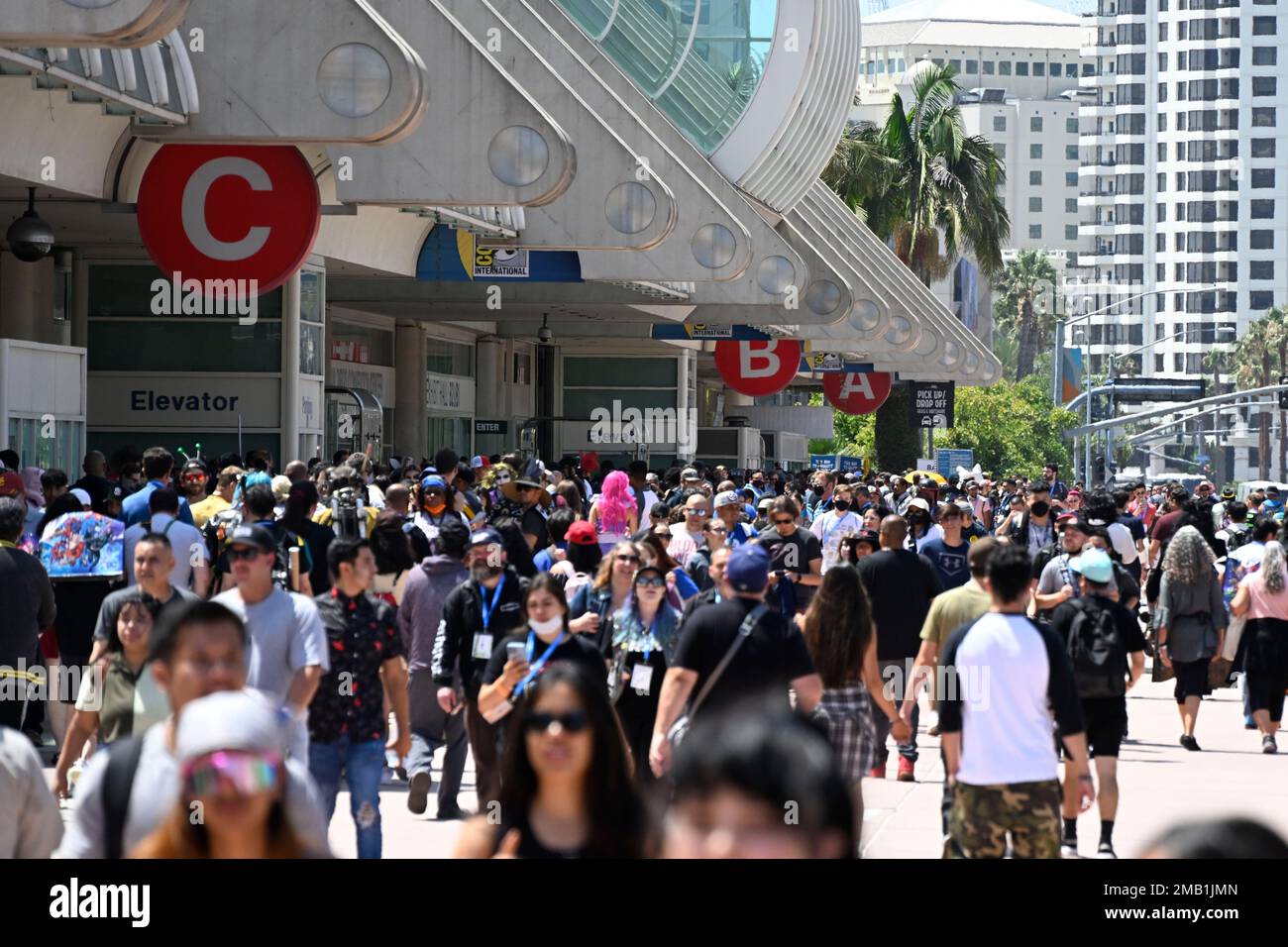 Fans walk front of the convention center on day three of Comic-Con ...