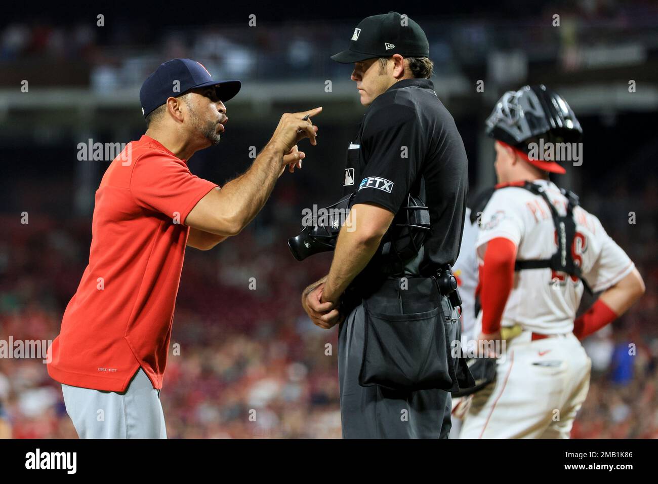 St. Louis Cardinals' Oliver Marmol, left, yells at MLB umpire Ryan ...