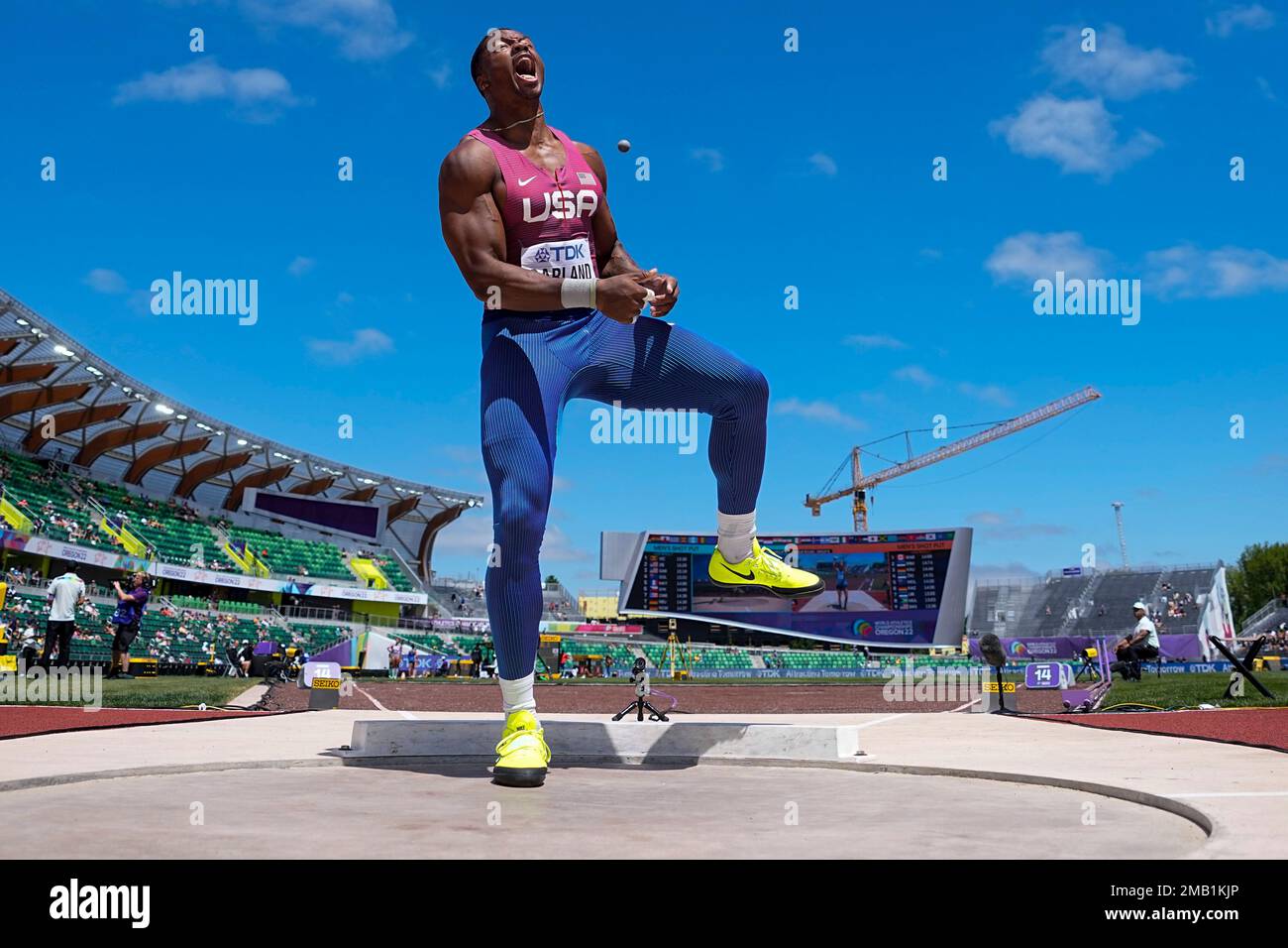 Kyle Garland, of the United States, competes in the decathlon shot put ...