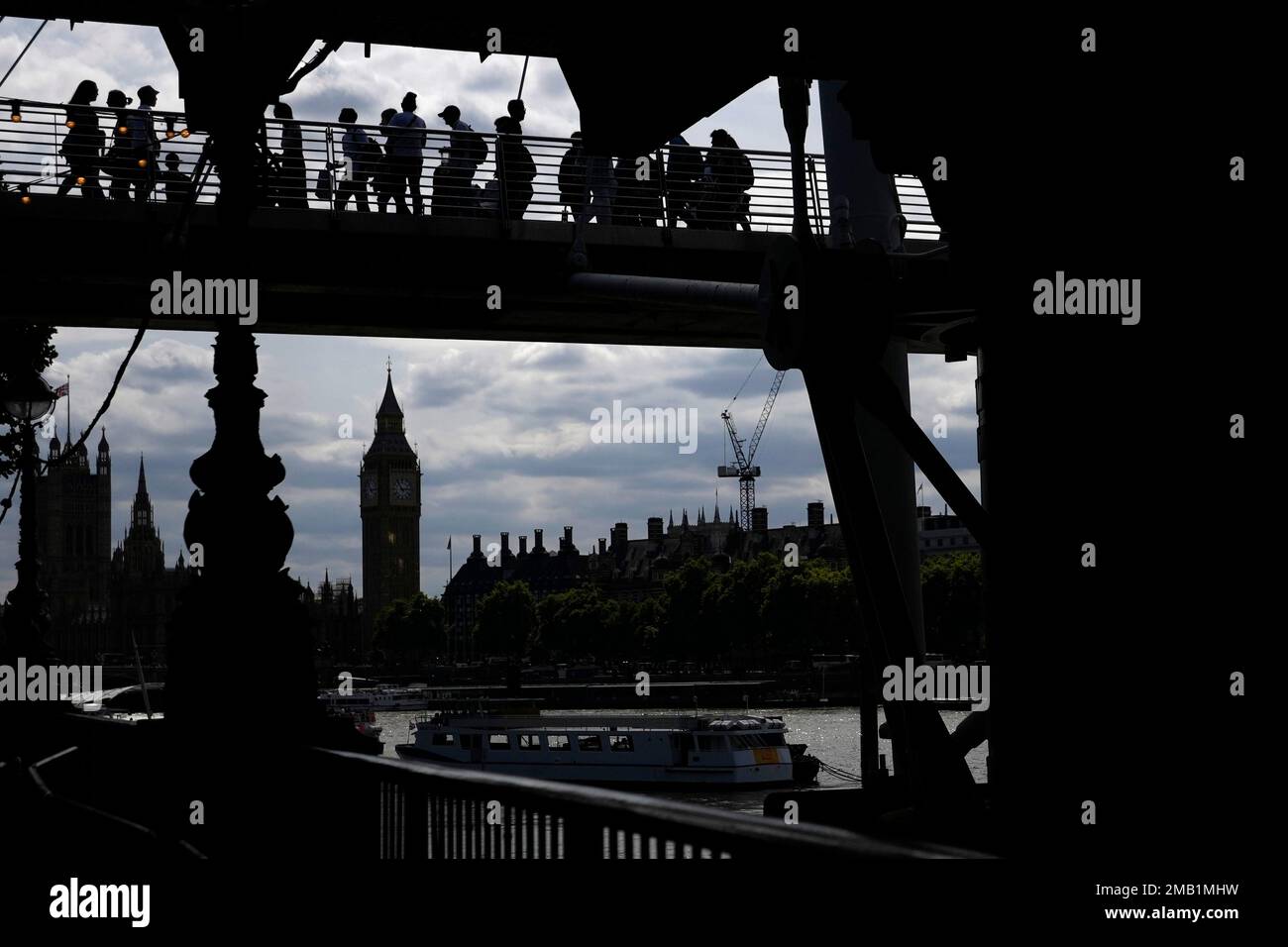 People walk in the South Bank in London, Saturday, July 23, 2022. (AP ...