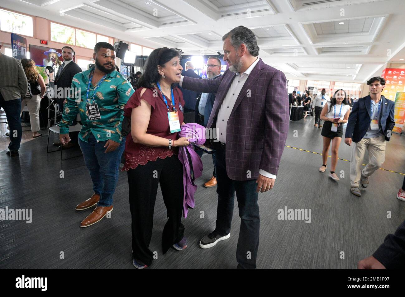 Sen. Ted Cruz, R-Texas, center right, stops to talk with an attendee ...